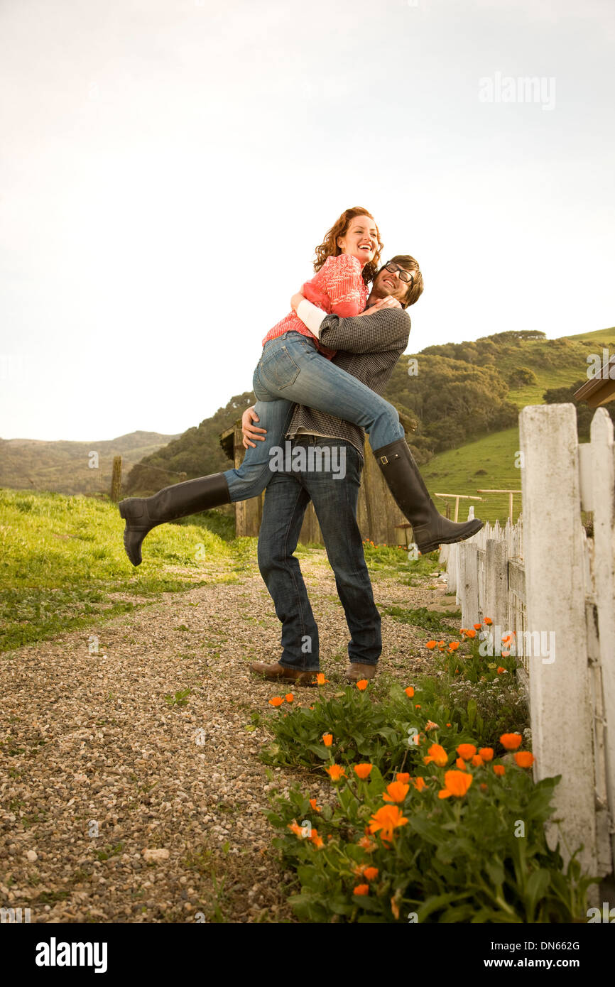 Couple hugging in rural landscape Stock Photo - Alamy