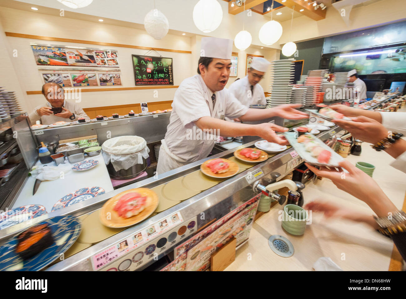 Moving sushi restaurant hi-res stock photography and images - Alamy
