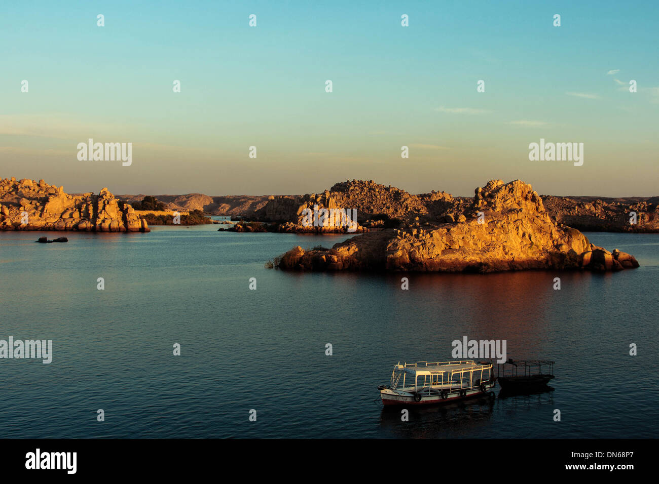 Nile river Aswan boat sunset nuba Egypt rocks hill rocks mountain water ...