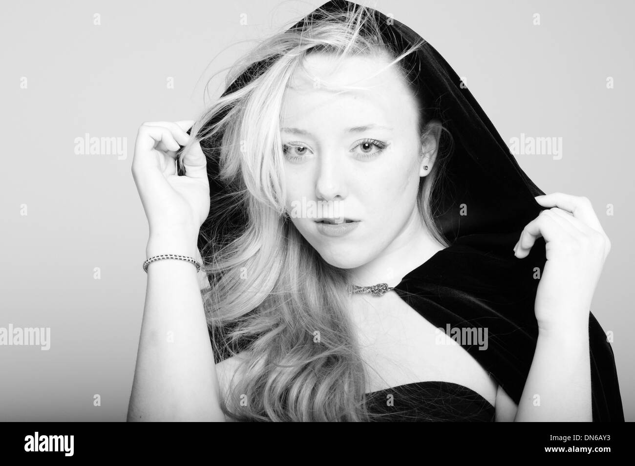 model looking into camera displaying moody look with gothic long black ...