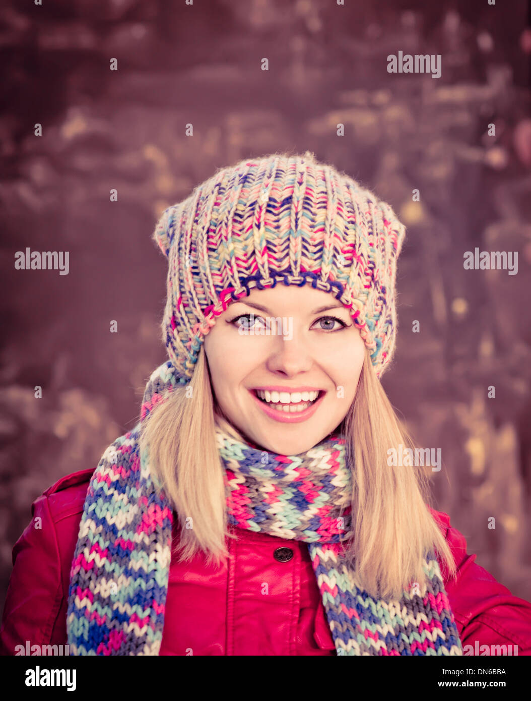 Winter Woman Beautiful happy smiling Face wearing knitted hat and scarf ...