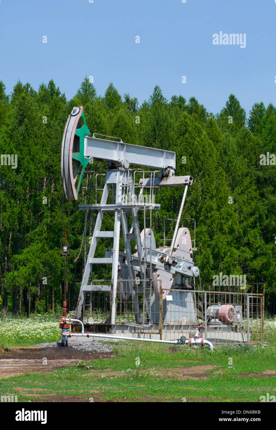 oil pump on a background the forest Stock Photo - Alamy