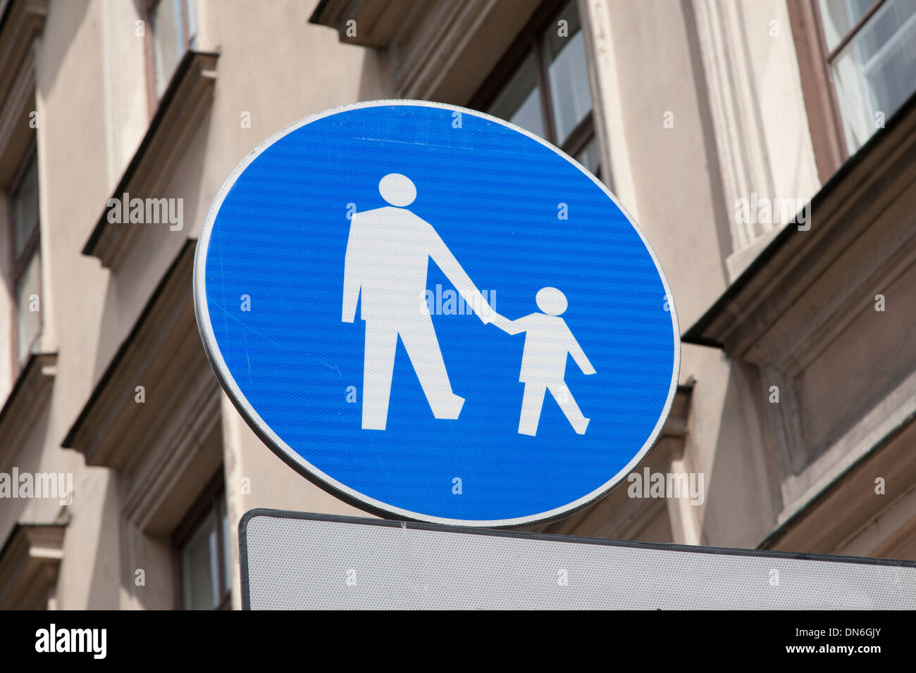 Blue Pedestrian Sign in Urban Setting Stock Photo - Alamy