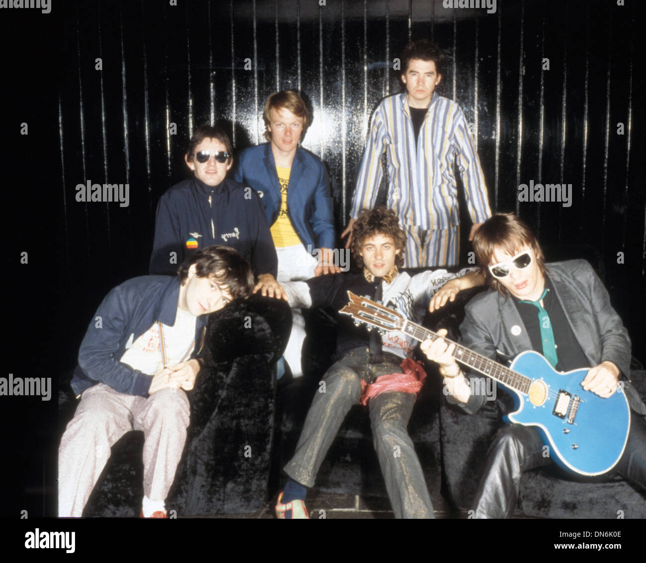 BOOMTOWN RATS UK rock group about 1984 with Bob Geldof seated centre ...