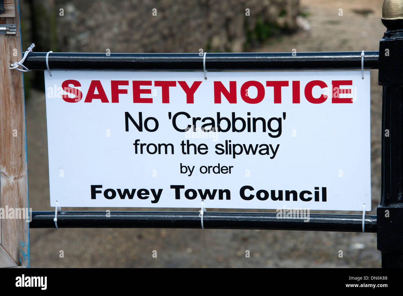 Safety Notice No Crabbing Fowey Cornwall UK Stock Photo - Alamy