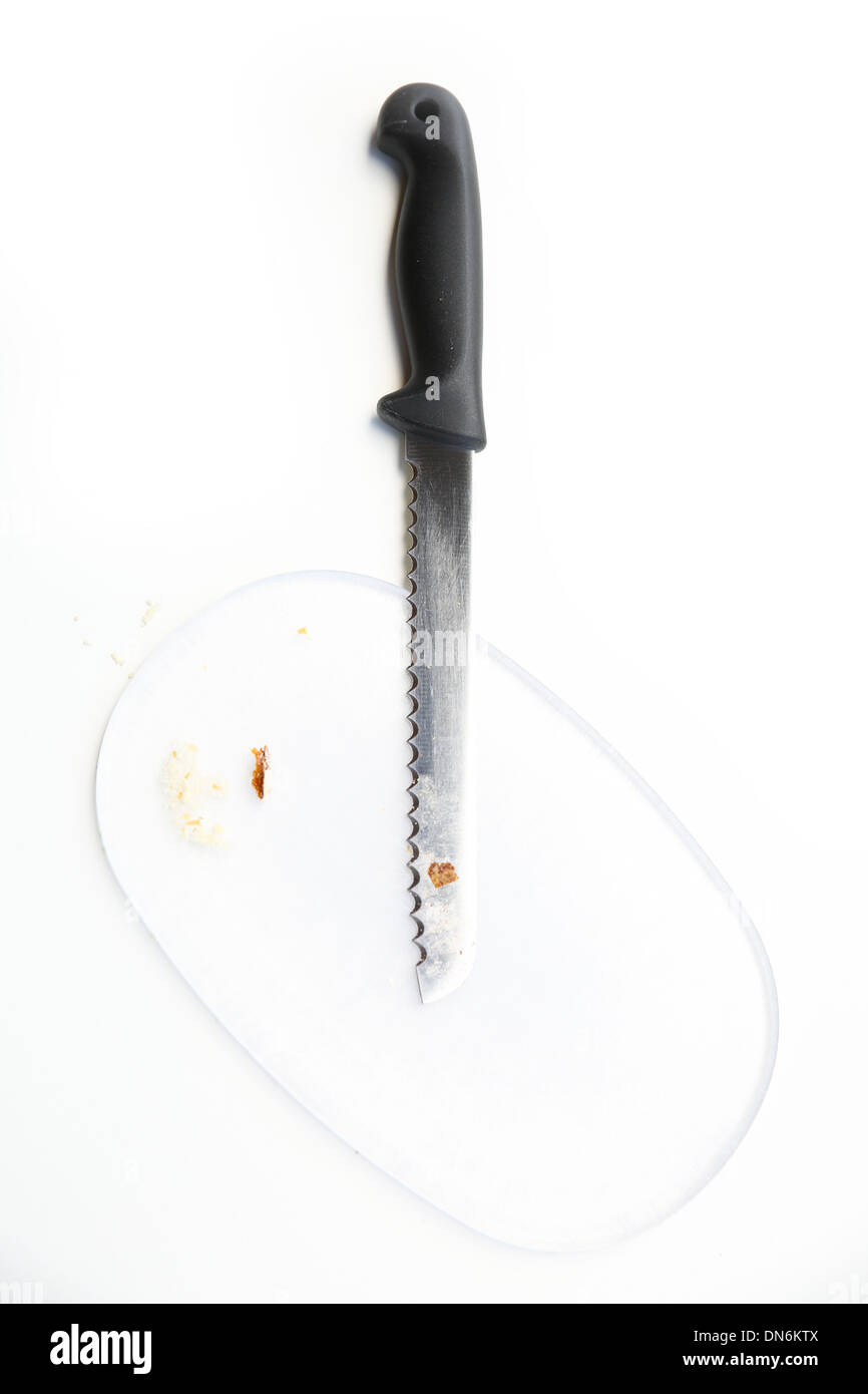 A dirty Knife and a Trencher after cutting cake Stock Photo - Alamy
