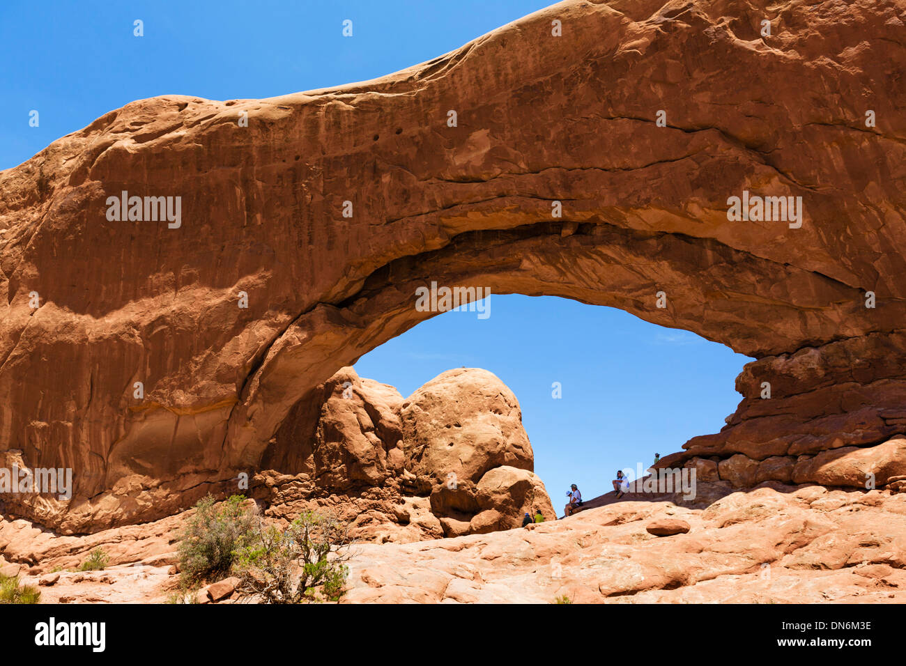 Tourists at North Window arch, The Windows Section, Arches National ...