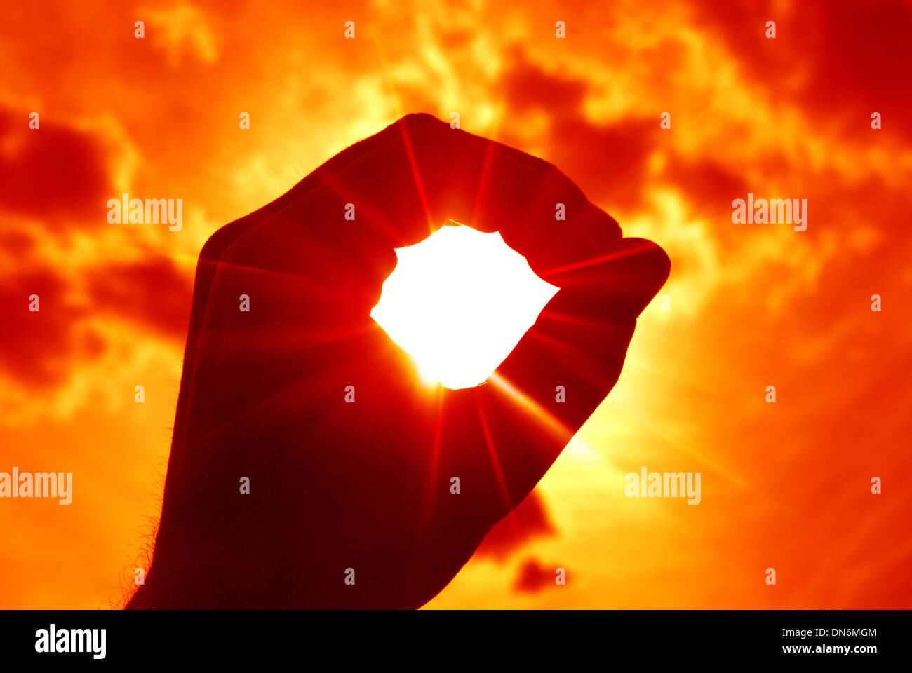 ring of fingers on sunset background Stock Photo - Alamy