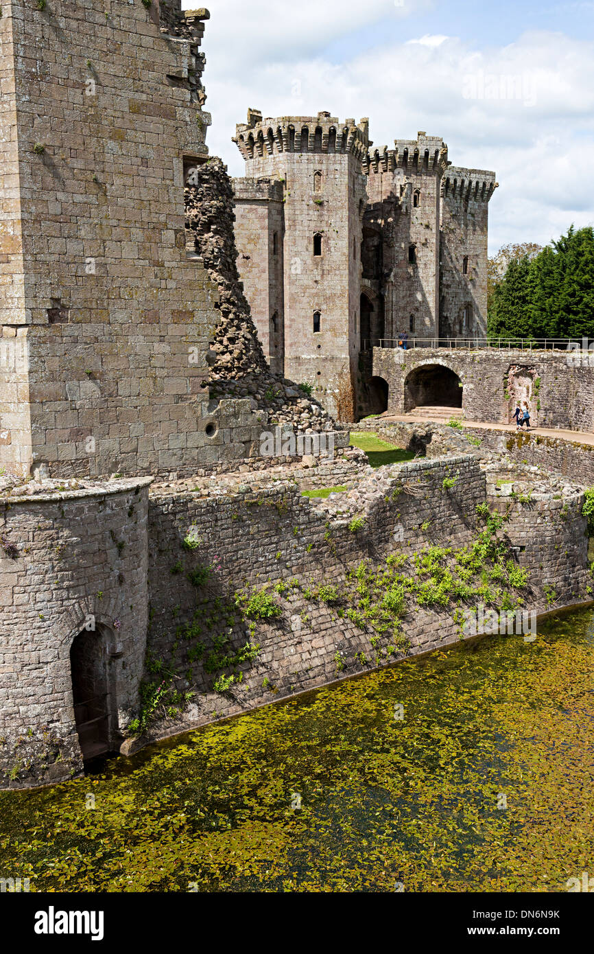 Moat and ruined walls with postern gate at Raglan Castle, Wales, UK ...