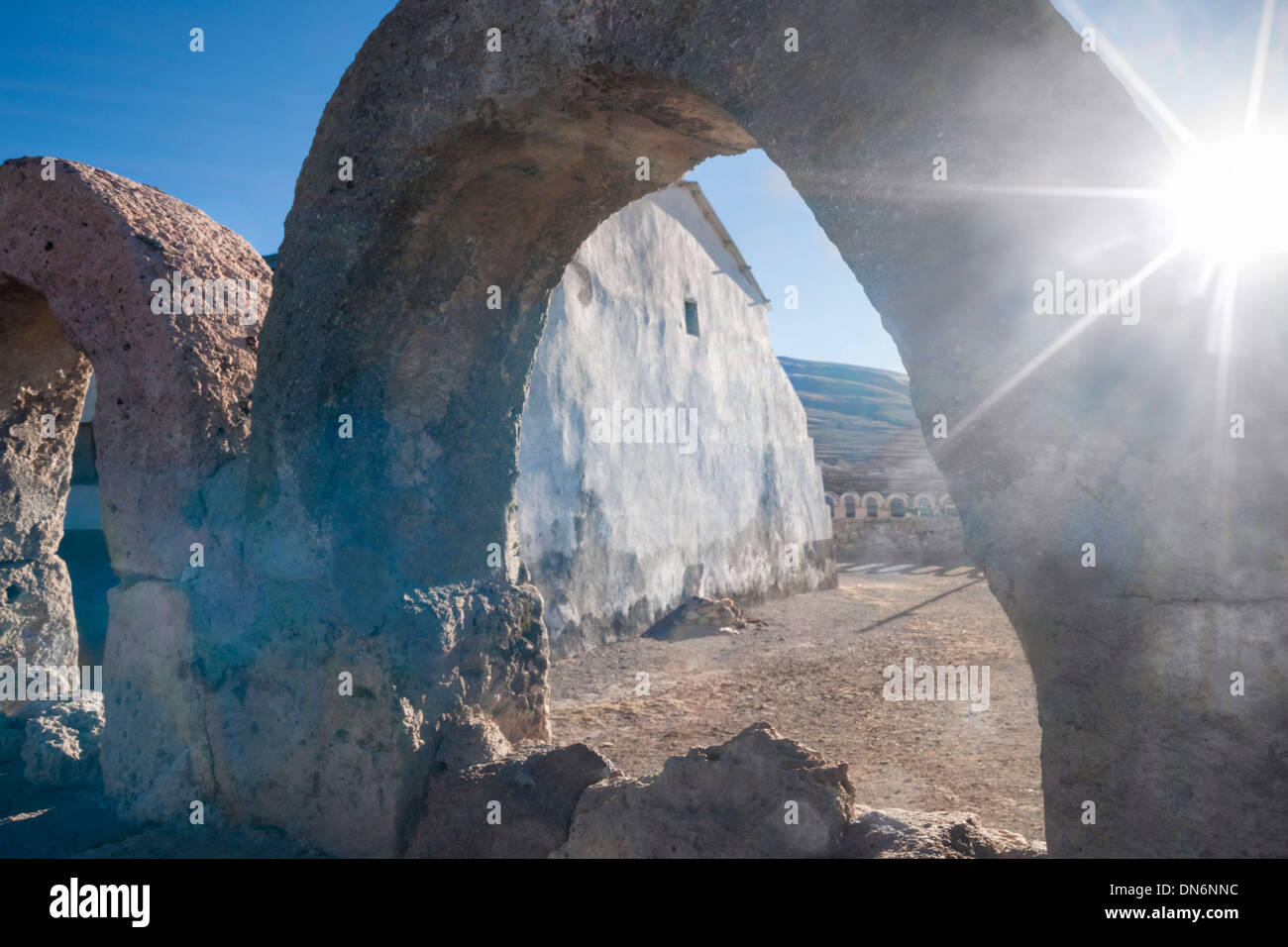 Backlit shot with sun star of limestone arch fence surrounding the ...