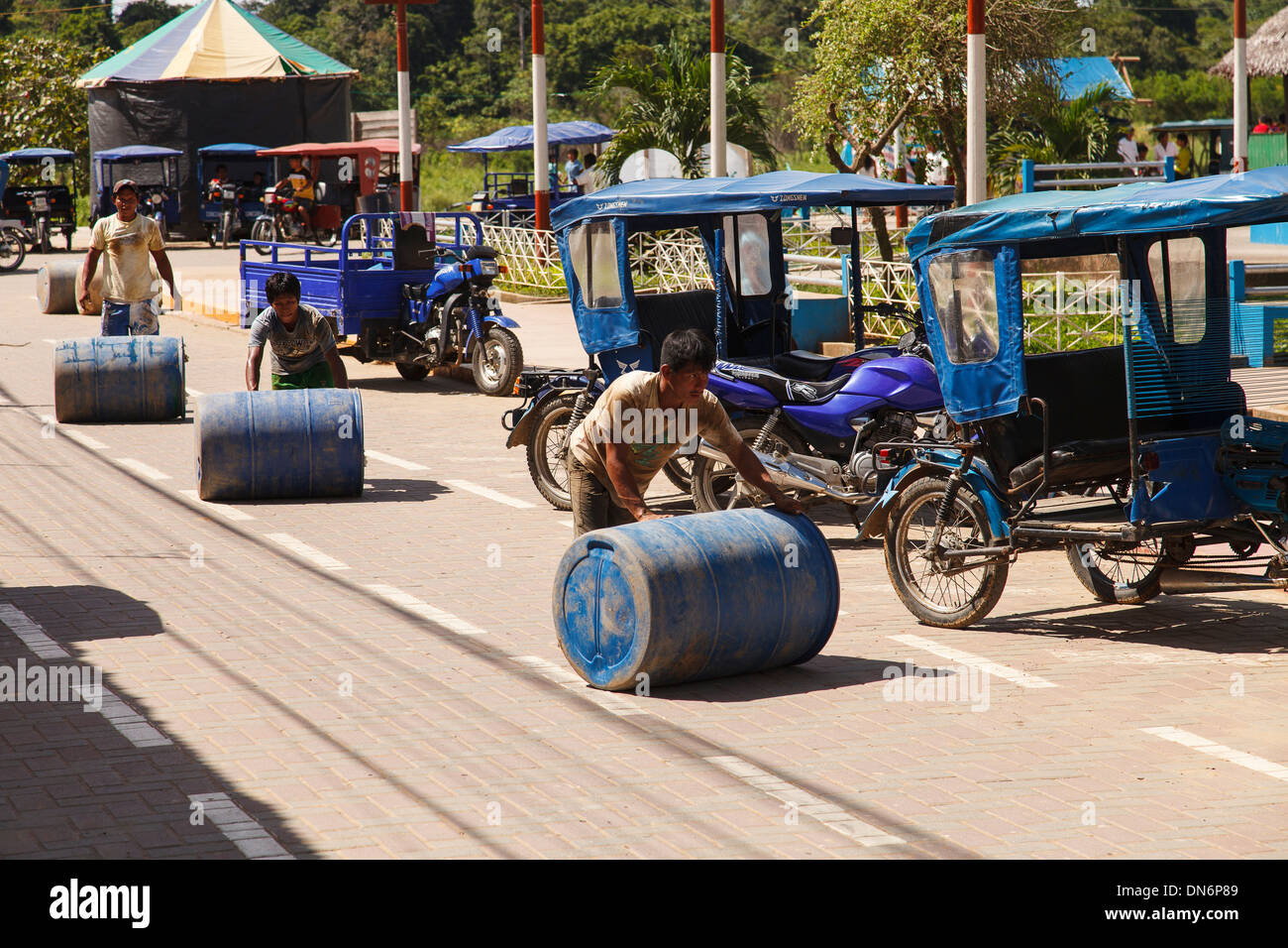 Men moving barrels, Caballococha, Amazonas river, Loreto, Peru Stock ...