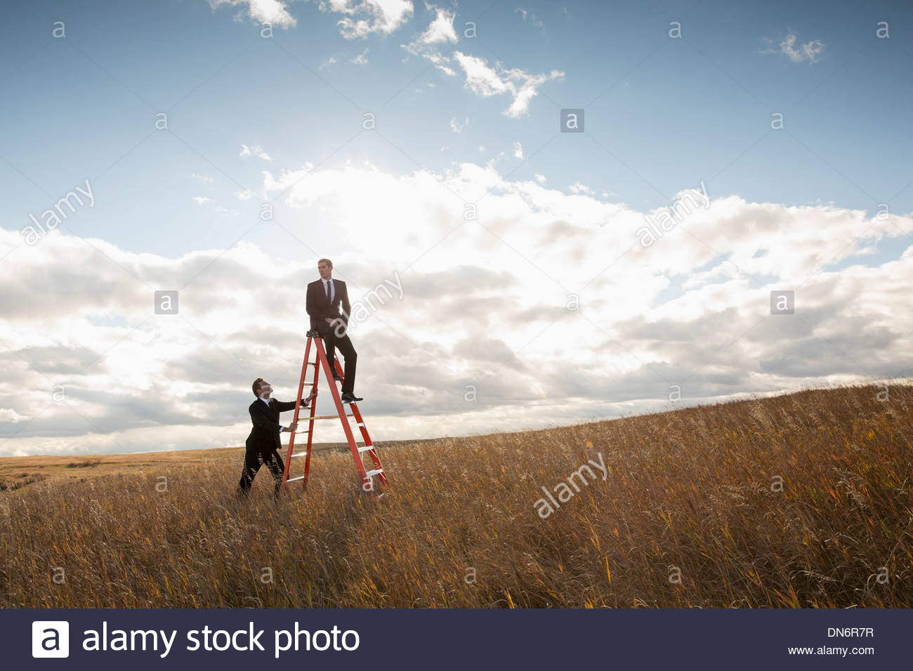 Businessman climbing hill hi-res stock photography and images - Alamy