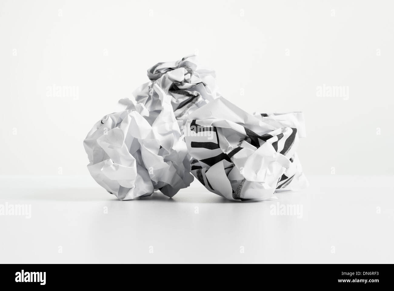 Three paper ball on desk Stock Photo - Alamy