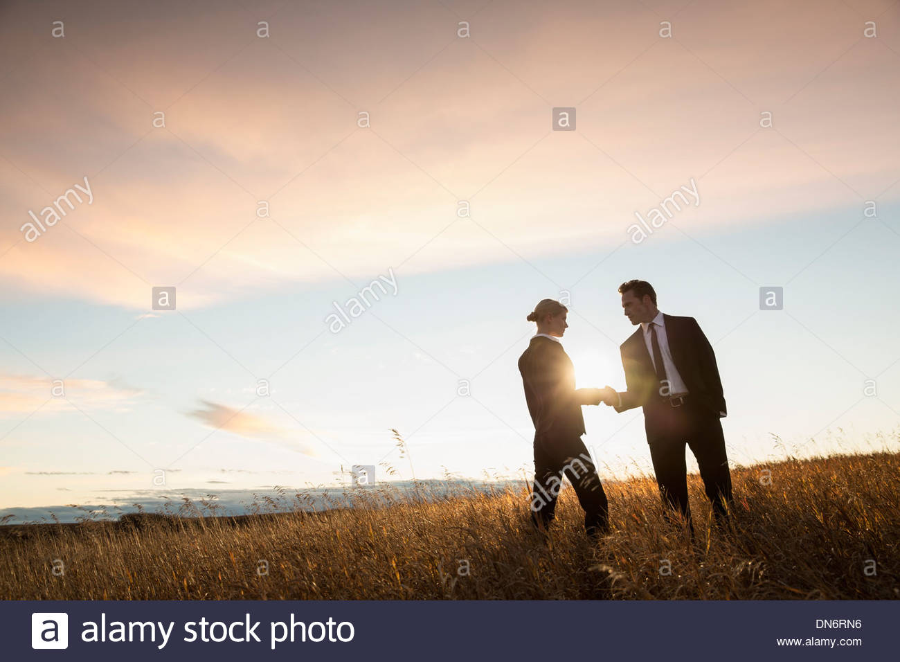 Three hands shaking hands hi-res stock photography and images - Alamy