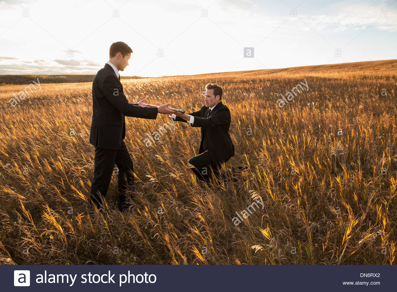 Businessman holding sword hi-res stock photography and images - Alamy