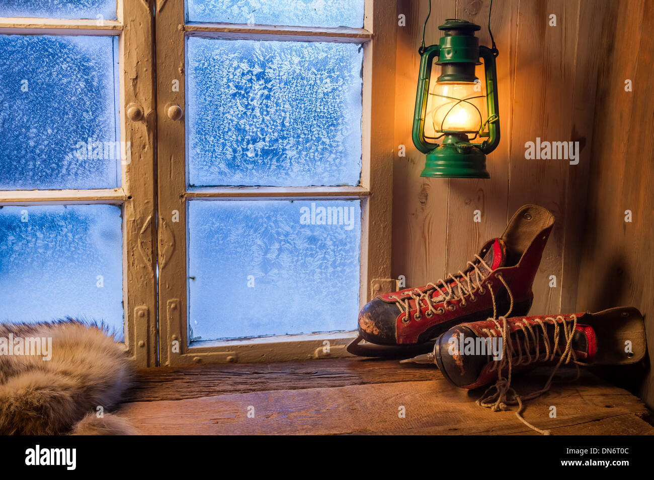 Warm cottage in a winter evening Stock Photo - Alamy