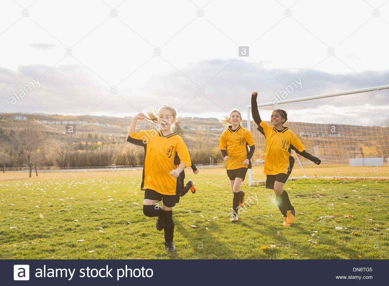 Successful soccer players running on hi-res stock photography and ...
