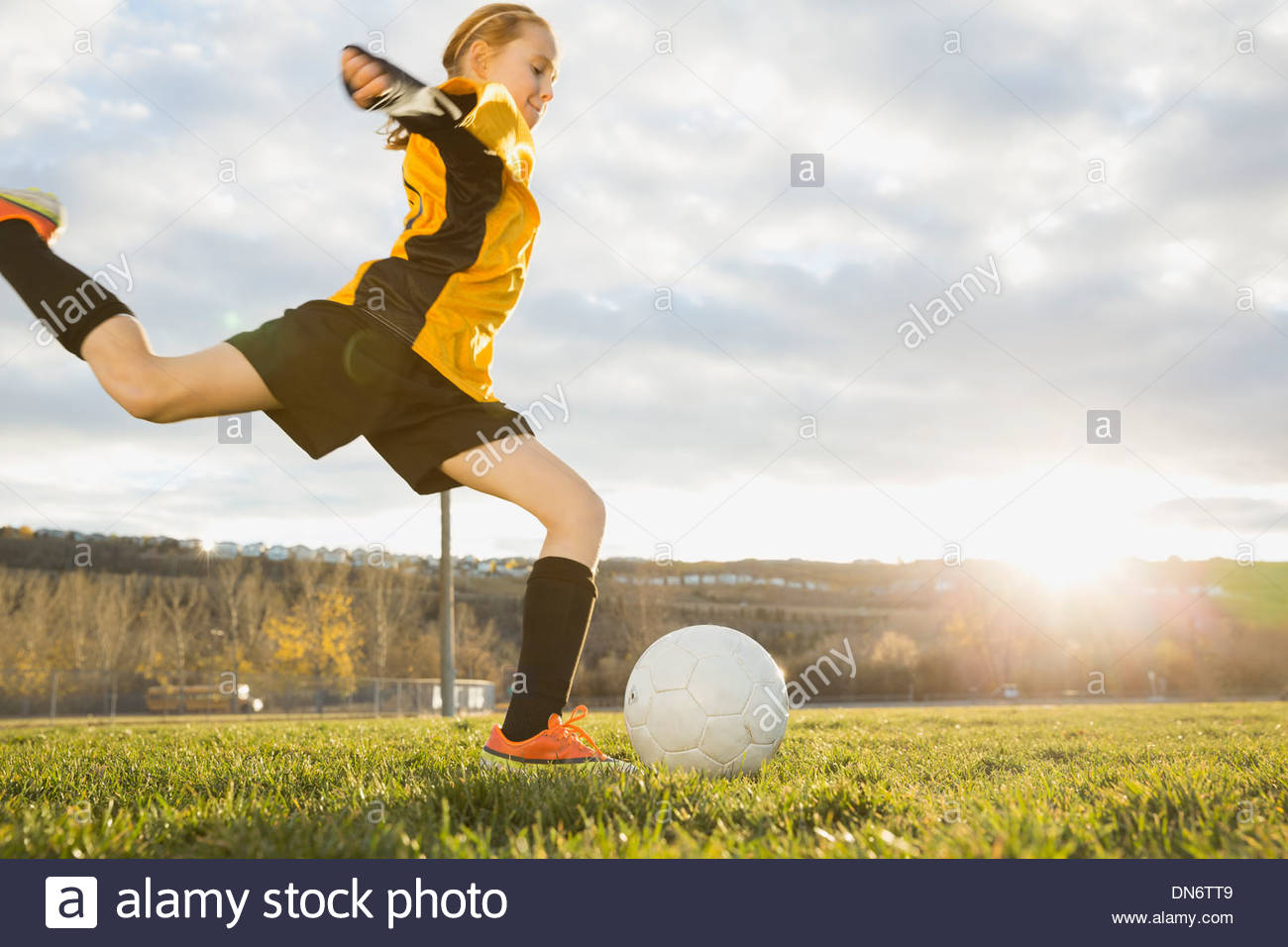 Woman Kicking Soccer Ball