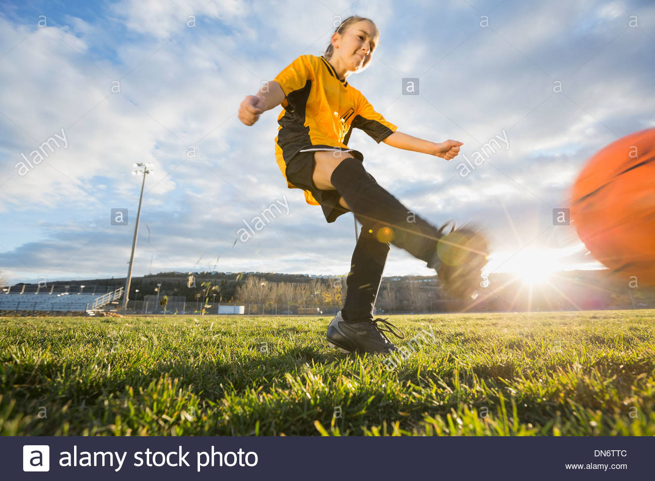 Woman Kicking Soccer Ball