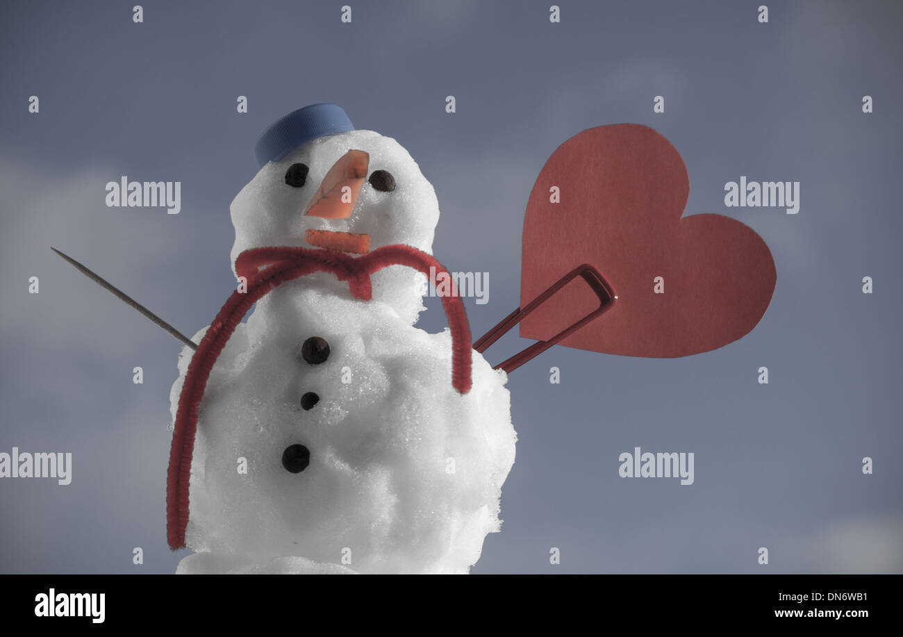 Winter. Funny valentine snowman with paper red heart love symbol for ...