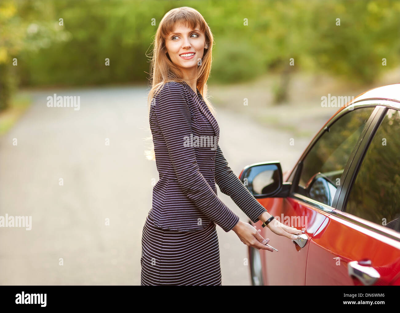 Girl open door red car hi-res stock photography and images - Alamy