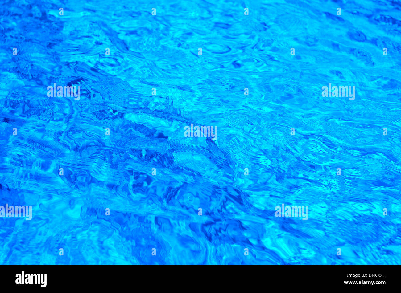 Bright blue water of the swimming pool Stock Photo - Alamy