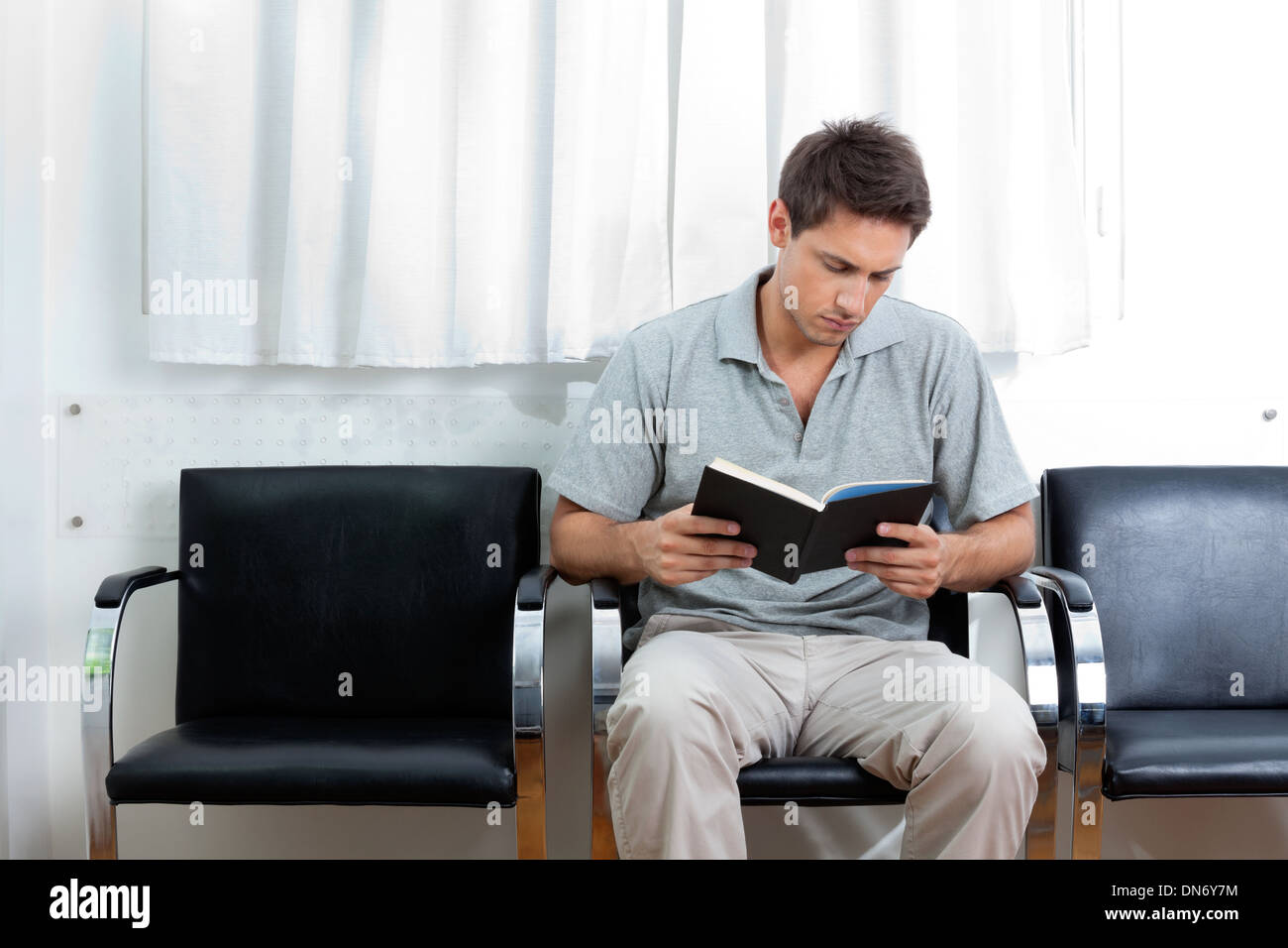 Man In Waiting Room Stock Photo - Alamy