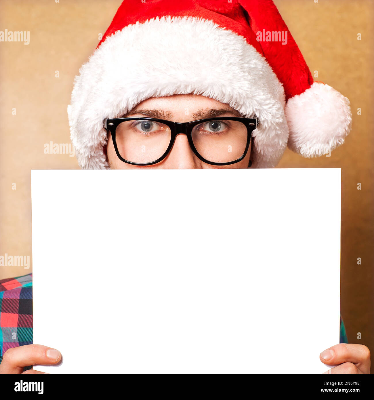 Santa Claus pointing in white blank sign with smile, isolated on ...