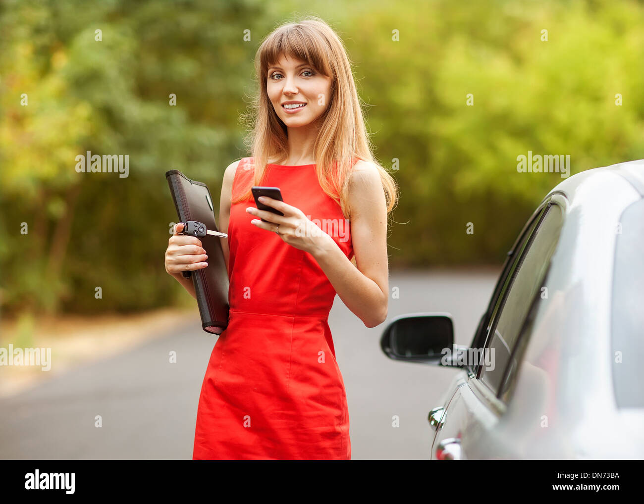 business woman standing near car Stock Photo - Alamy