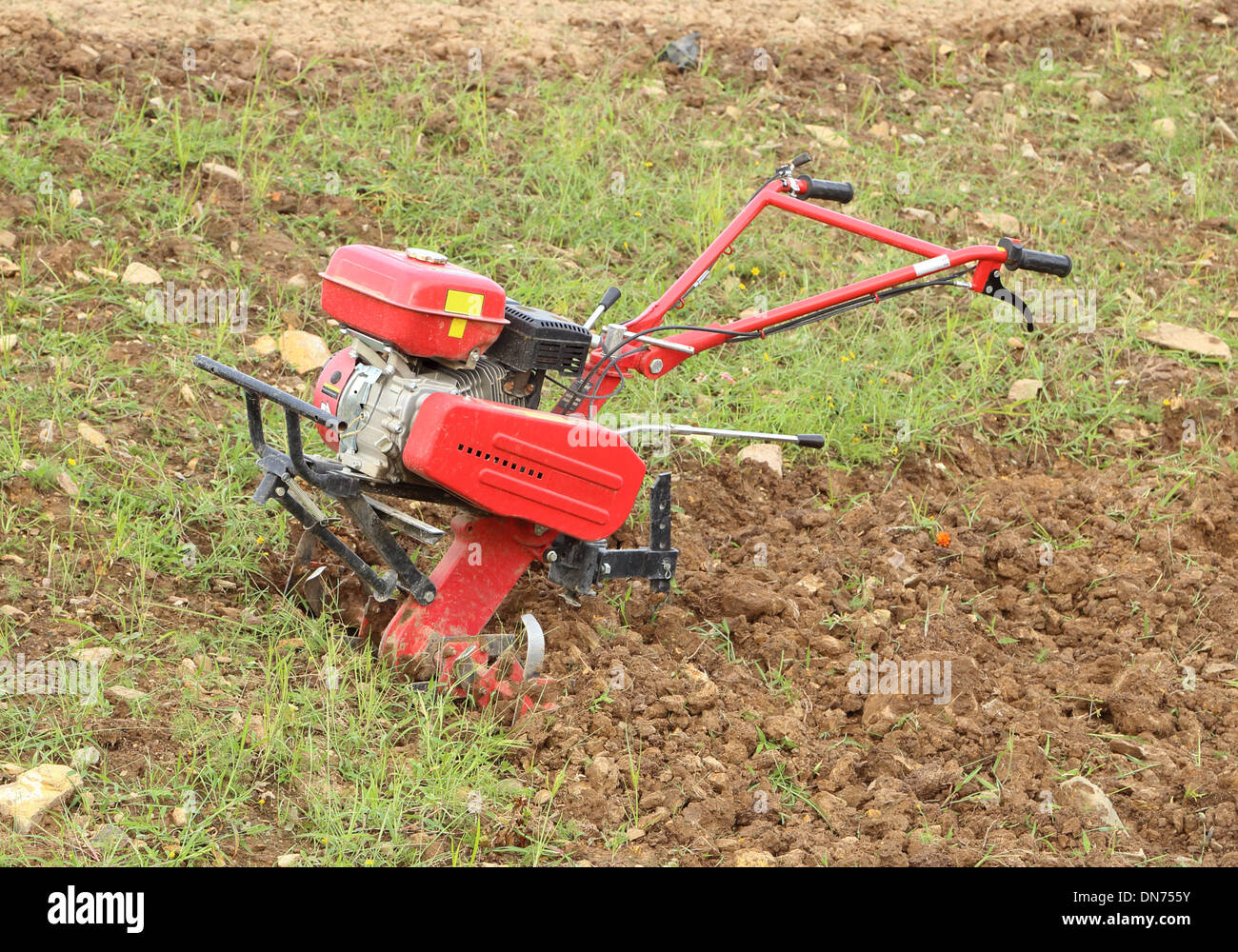 small hand tractor in the garden Stock Photo - Alamy