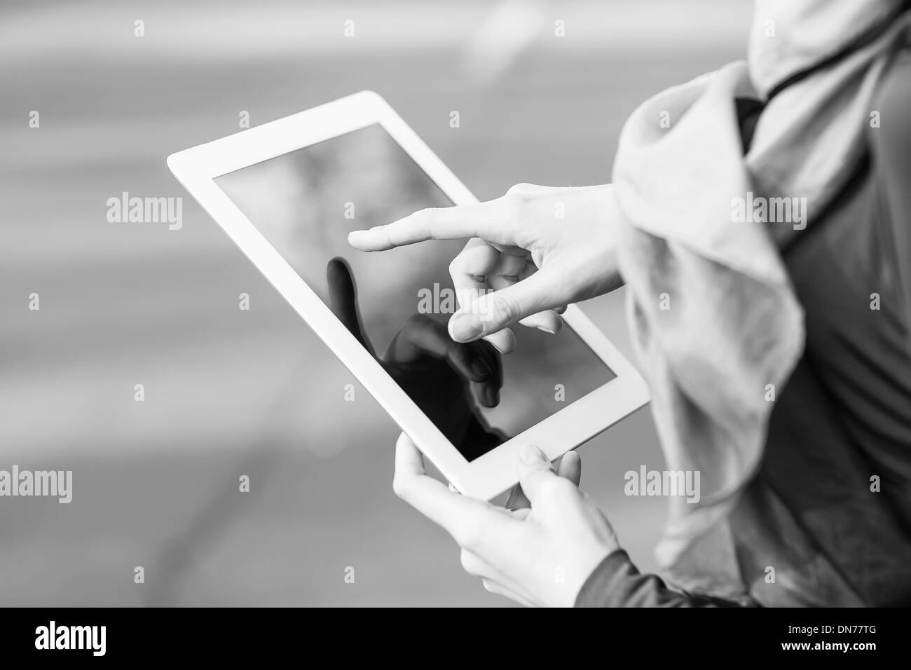Hand holding digital tablet Black and White Stock Photos & Images - Alamy