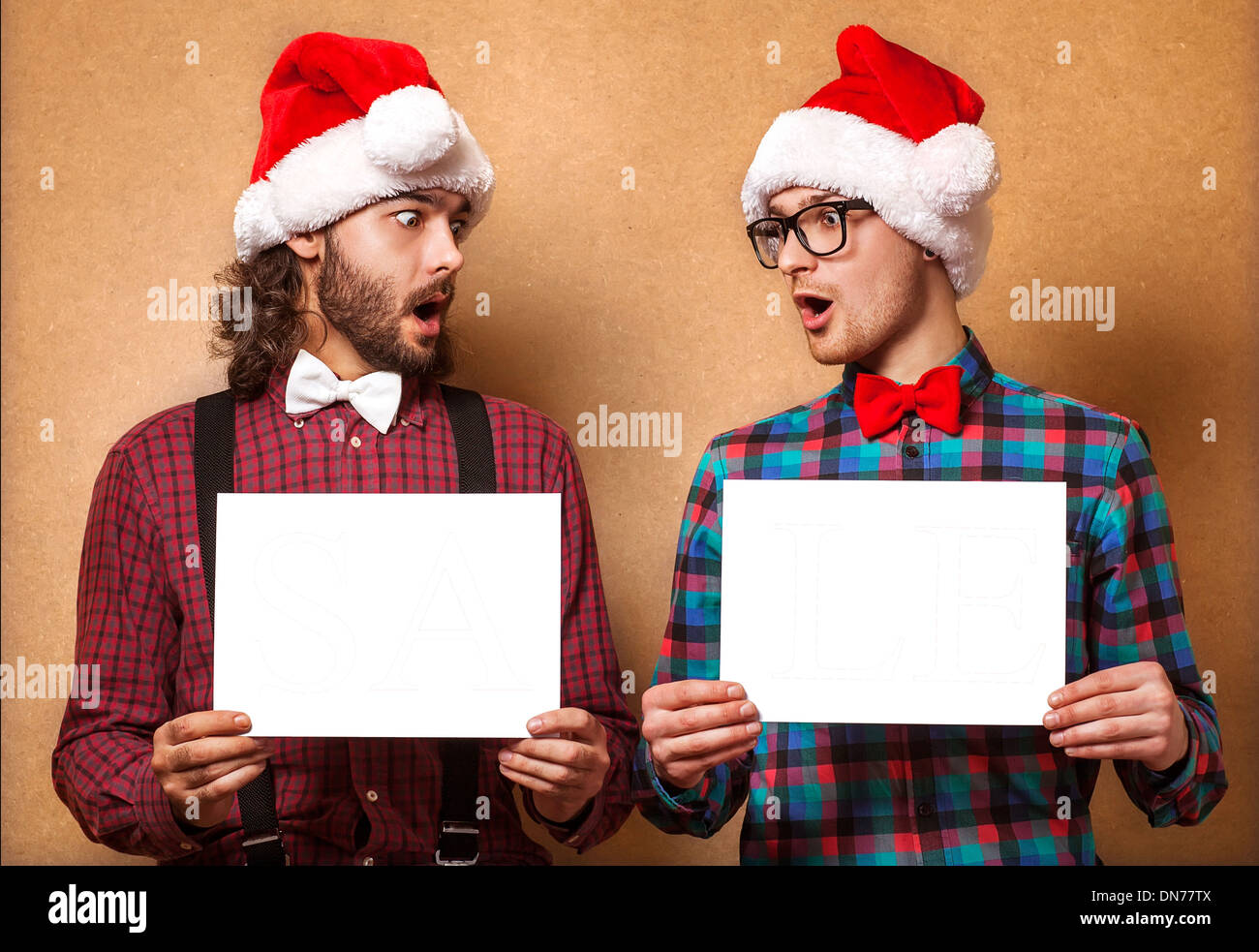 Christmas, x-mas, people, advertisement, sale concept - happy two man ...