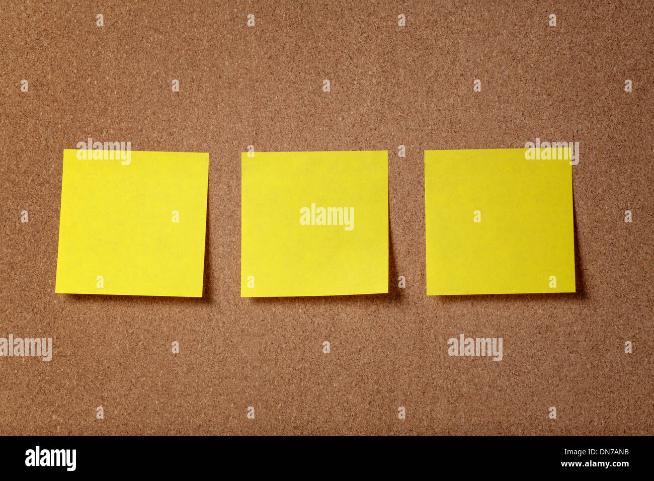 three reminder sticky notes on cork board, empty space for text Stock ...