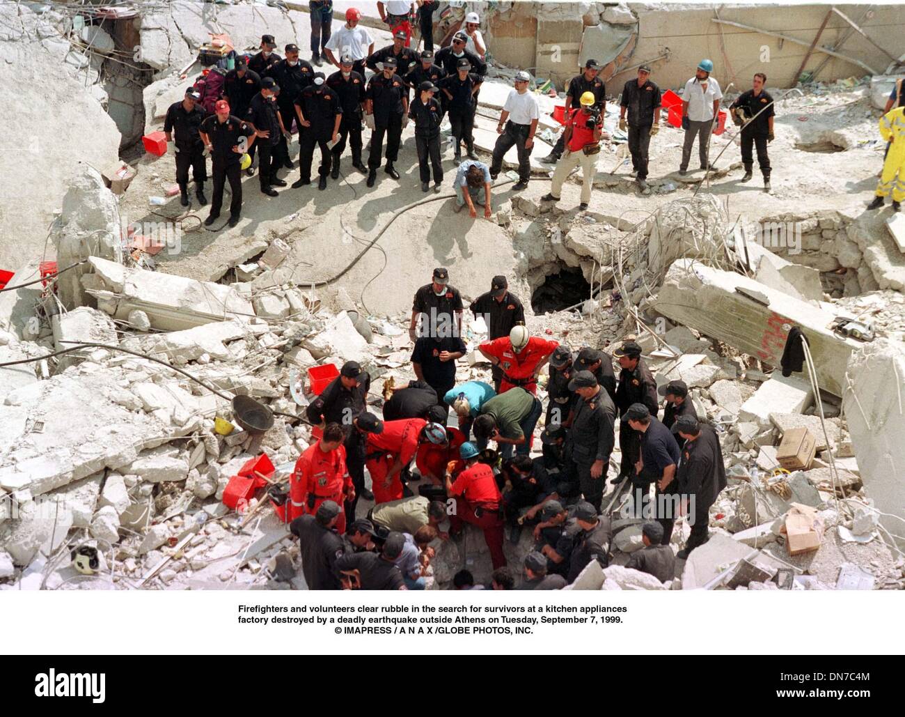Sept. 8, 1999 - Athens, GRC - Firefighters and volunteers clear rubble ...