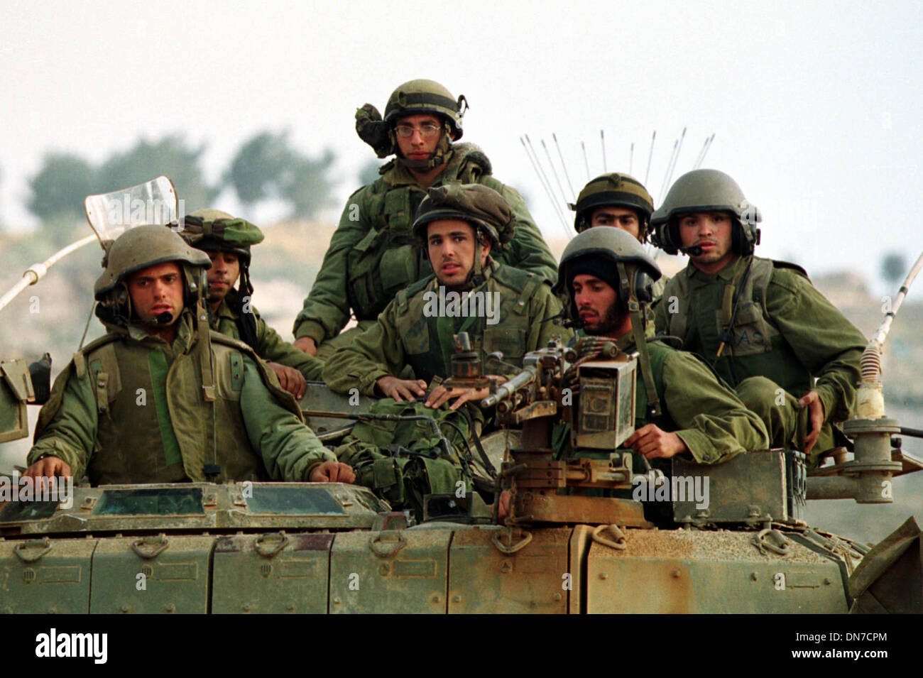 May 24, 2000 - Metulla, ISRAEL - Israeli soldiers atop their tank cross ...