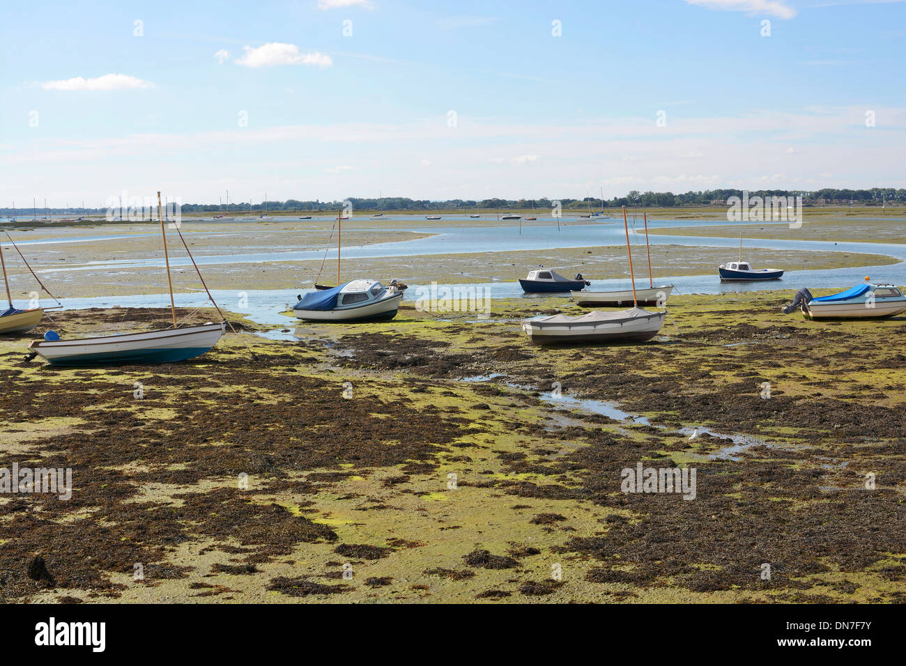 Boats on beach at low tide in Emsworth. Hampshire. England Stock Photo ...