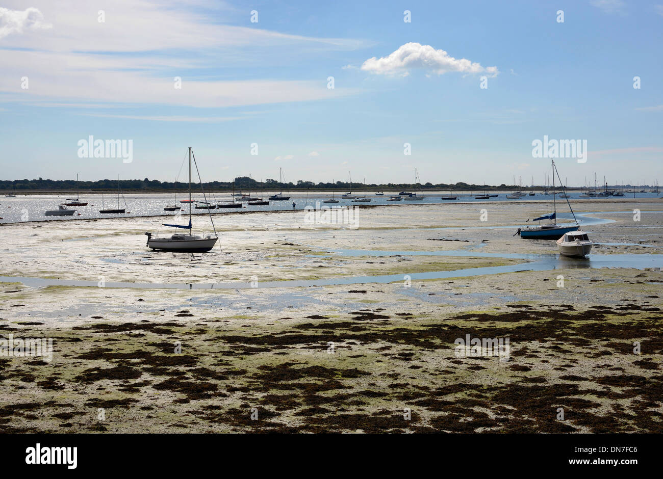 Boats on beach at low tide in Emsworth. Hampshire. England Stock Photo ...