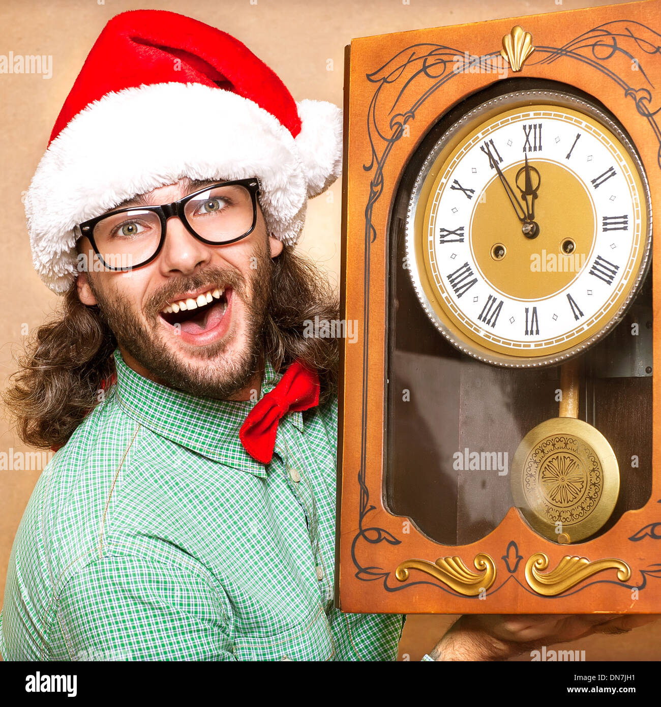 Photo of stunned Santa holding clock showing five minutes to midnight ...