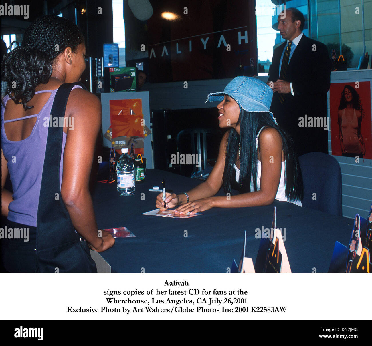 July 26, 2001 - Aaliyah.signs copies of her latest CD for fans at the ...