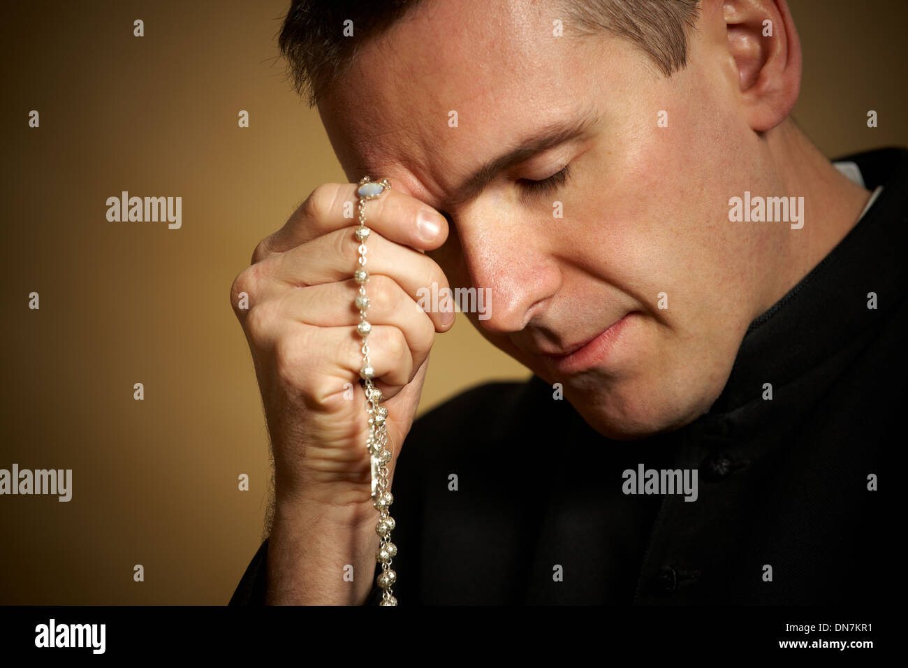 Young pastor rosary bible hi-res stock photography and images - Alamy