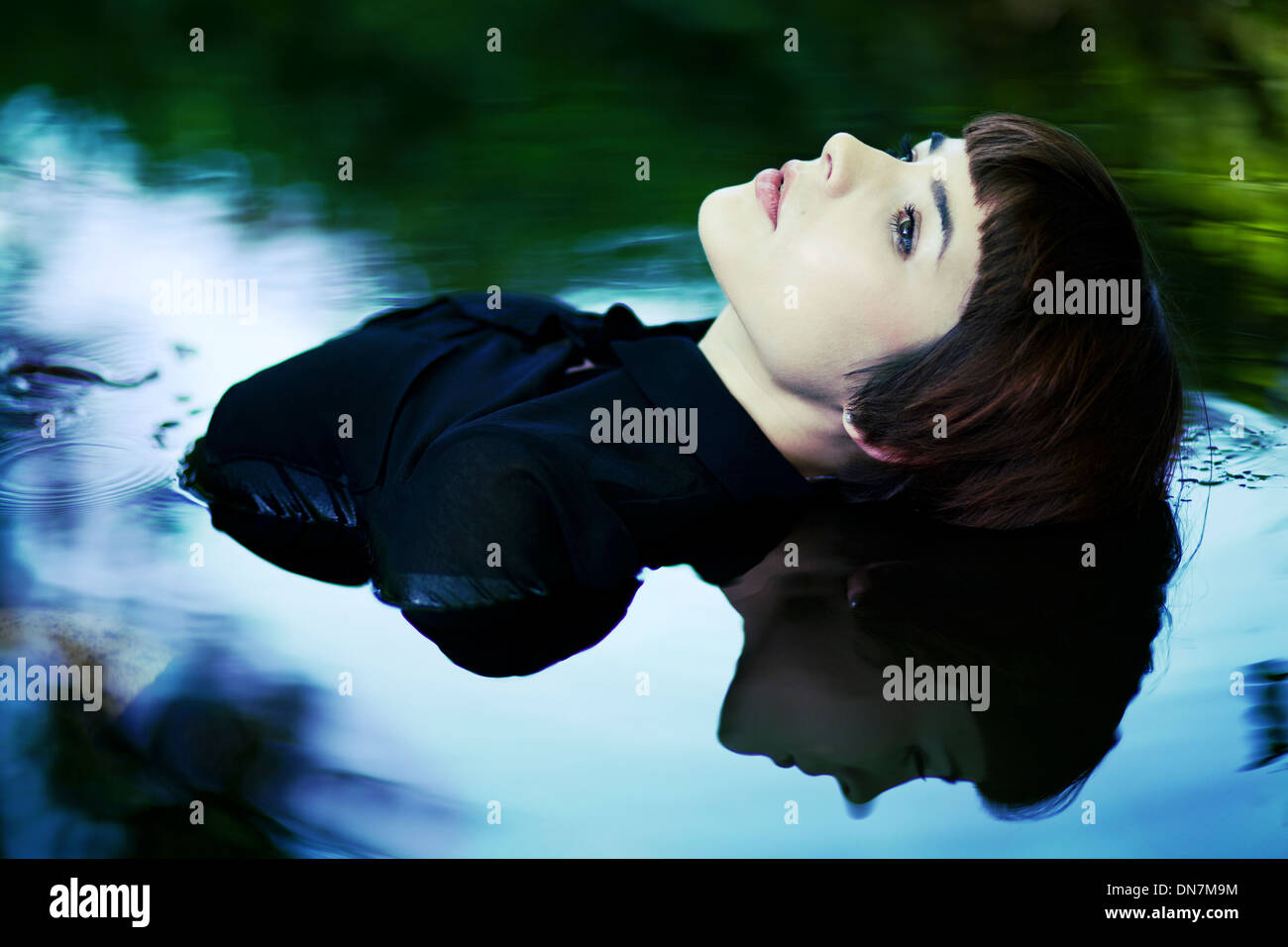 Contemplative young adult woman in hi-res stock photography and images ...