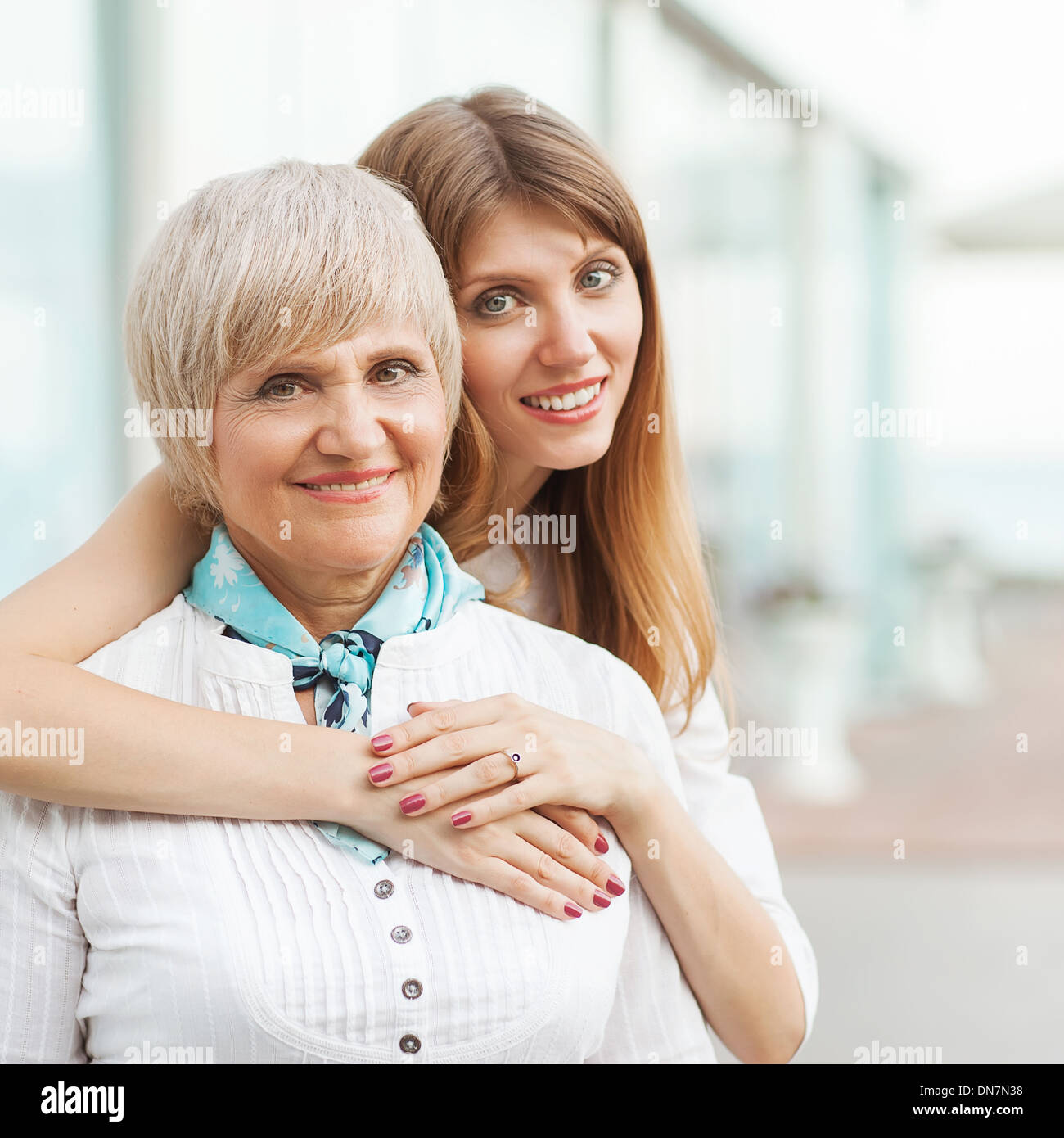 Happy mother daughter cuddling hi-res stock photography and images - Alamy