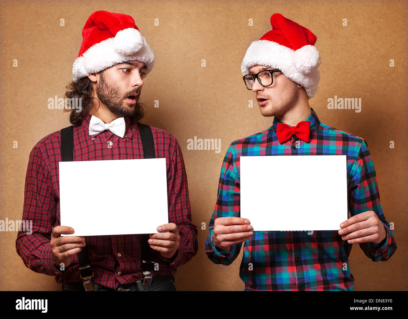 Christmas, x-mas, people, advertisement, sale concept - happy two man ...