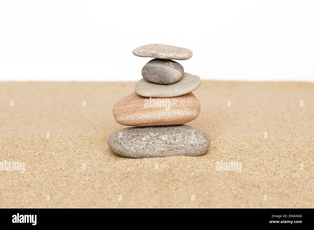pyramid with five stones on a white background Stock Photo - Alamy