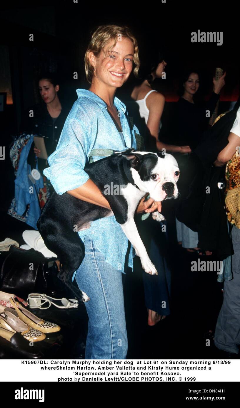 June 13, 1999 - K15907DL 06/13/99.Carolyn Murphy holding her dog at Lot ...