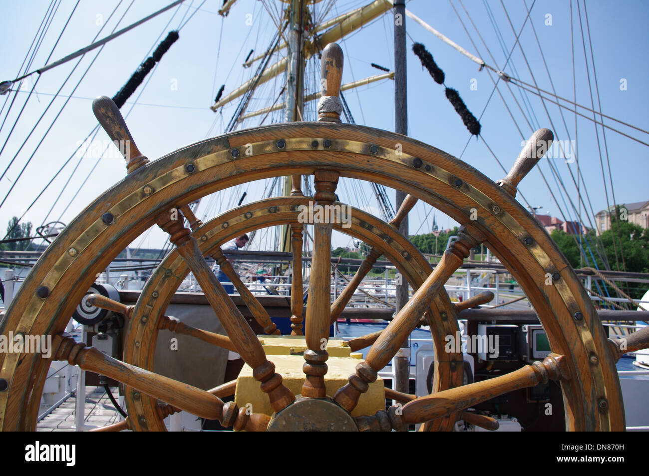 steering wheel of sailing-ship on a sky background Stock Photo - Alamy