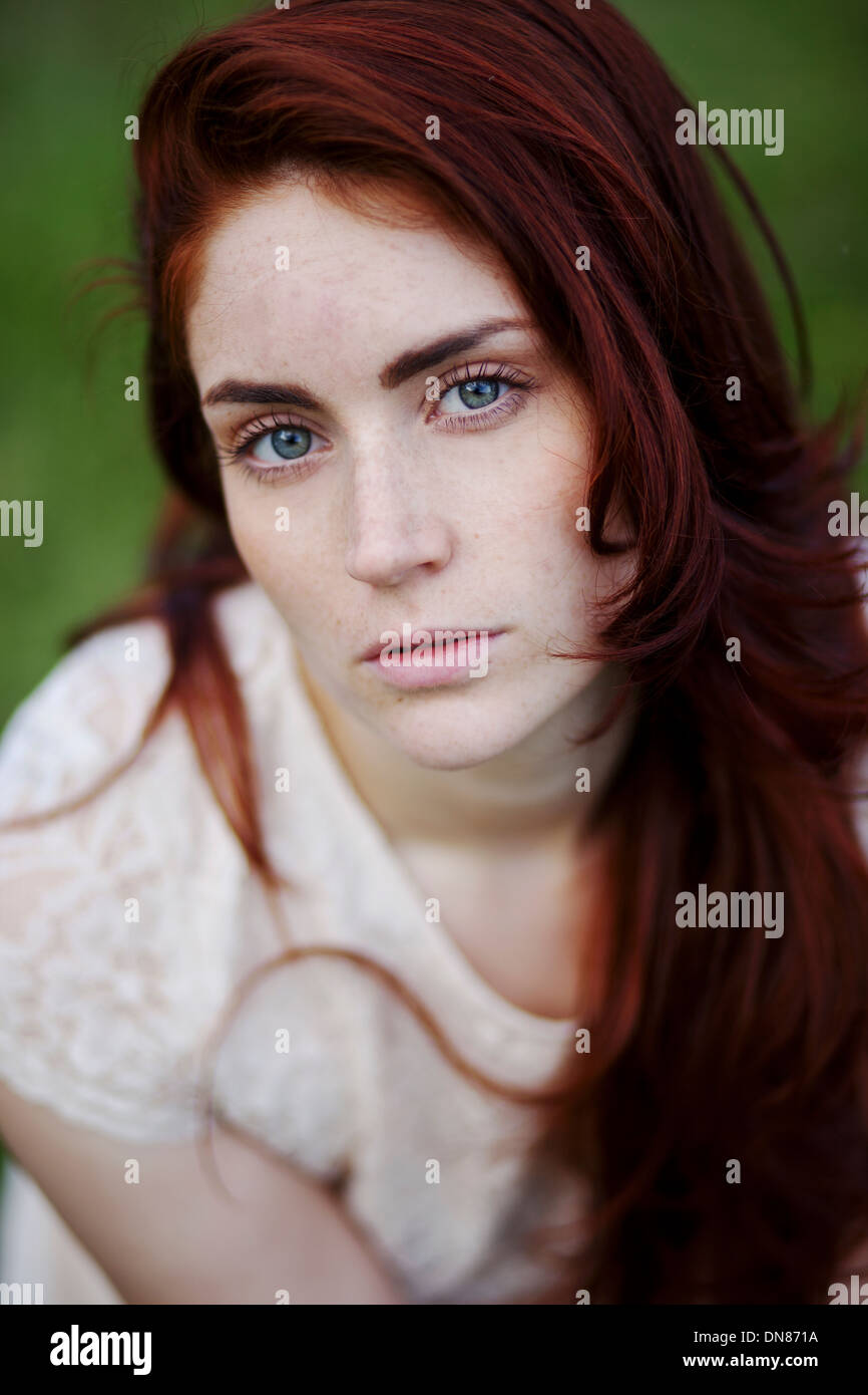 Young woman with serious expression, portrait Stock Photo - Alamy
