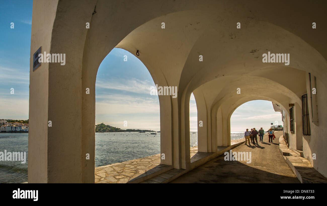Evening light spills through an archway in the seaside town of Cadaques ...