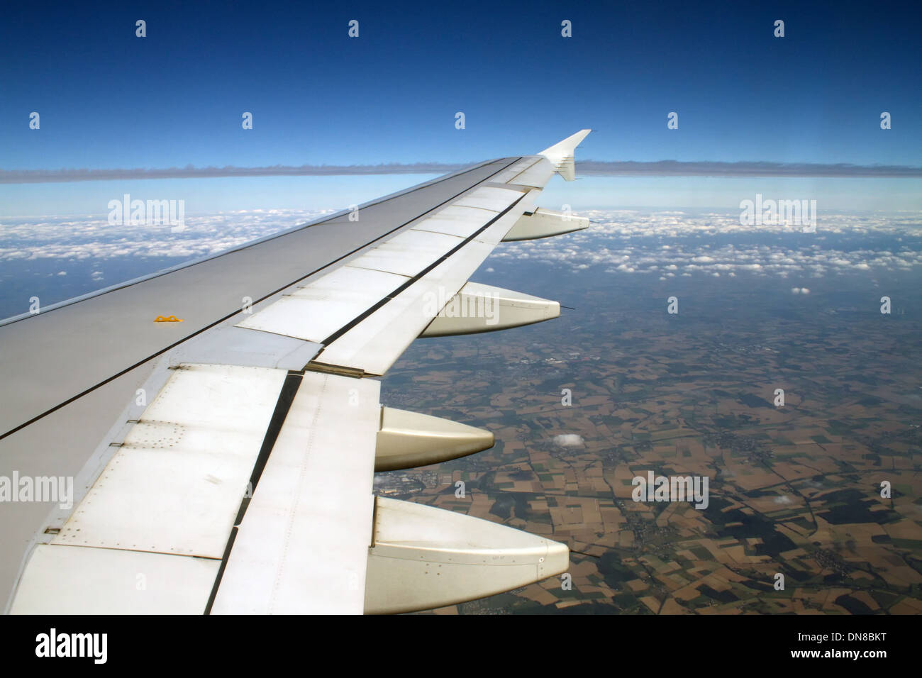 Airplaine view with the airplane wing Stock Photo - Alamy