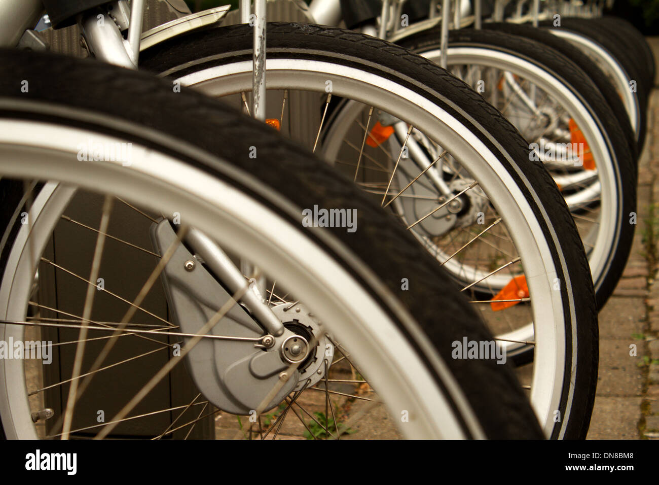 Bicycle wheels in series Stock Photo - Alamy